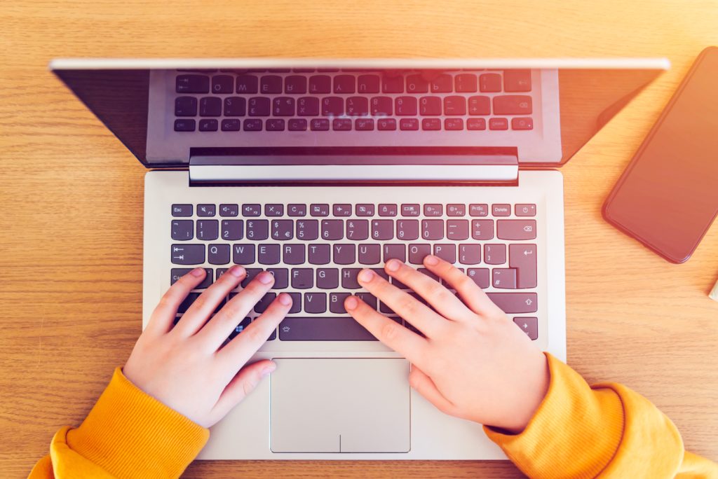 school-age-girl-is-home-schooling-using-laptop-during-self-isolation-at ...